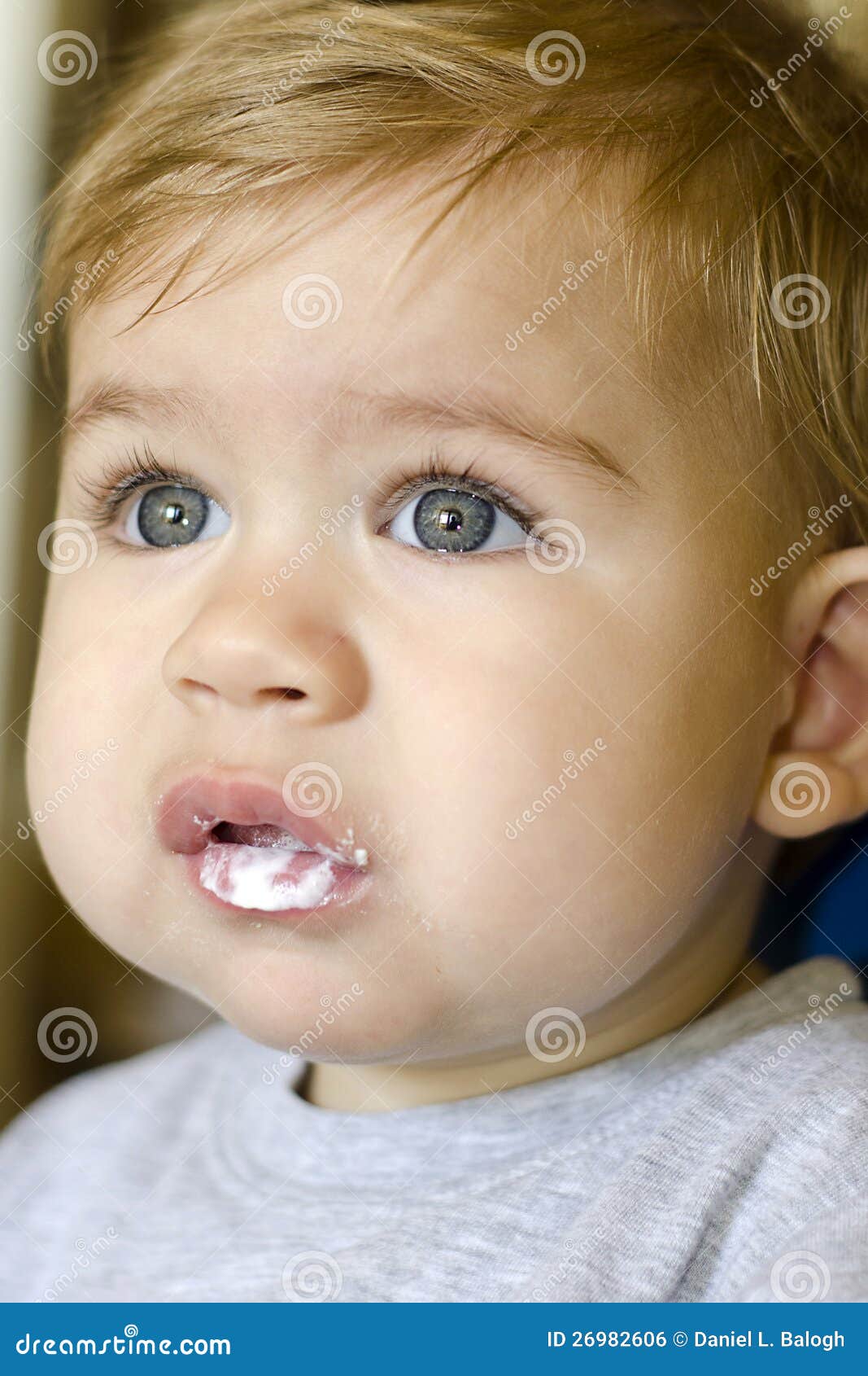 Young Boy with Beautiful Blue Eyes, Dubious Look Stock Photo - Image of ...