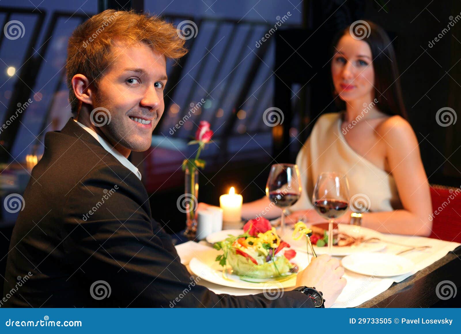 Boy and girl having dinner stock image. Image of evening - 29733505