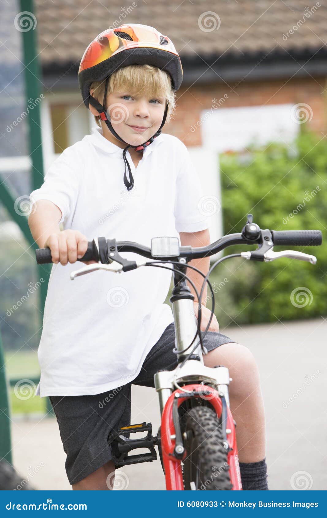 A young boy on a bicycle stock image. Image of outdoors - 6080933