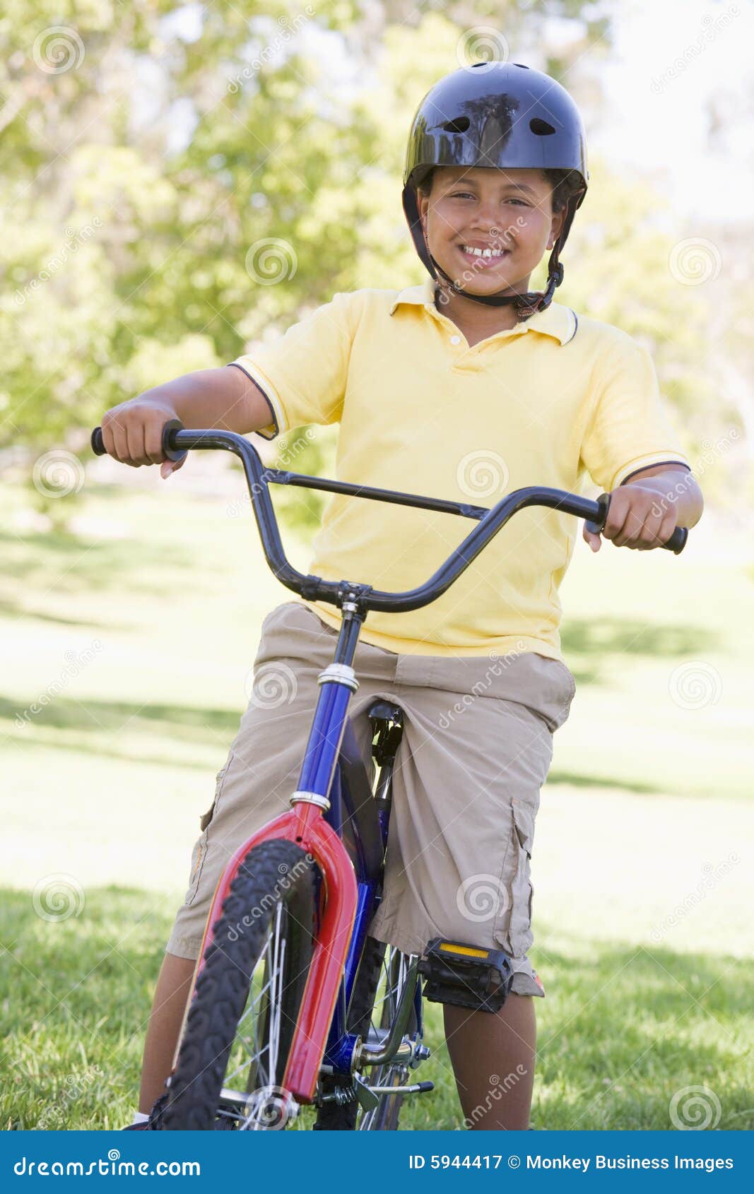 Young Boy on Bicycle Outdoors Smiling Stock Image - Image of bicycle ...