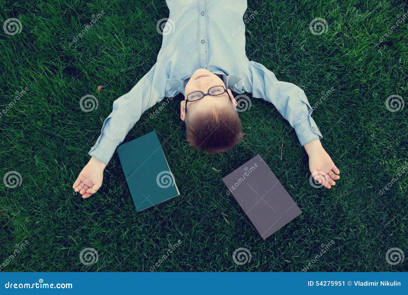 Young Boy with a Book Slipping Stock Image - Image of little, lawn ...