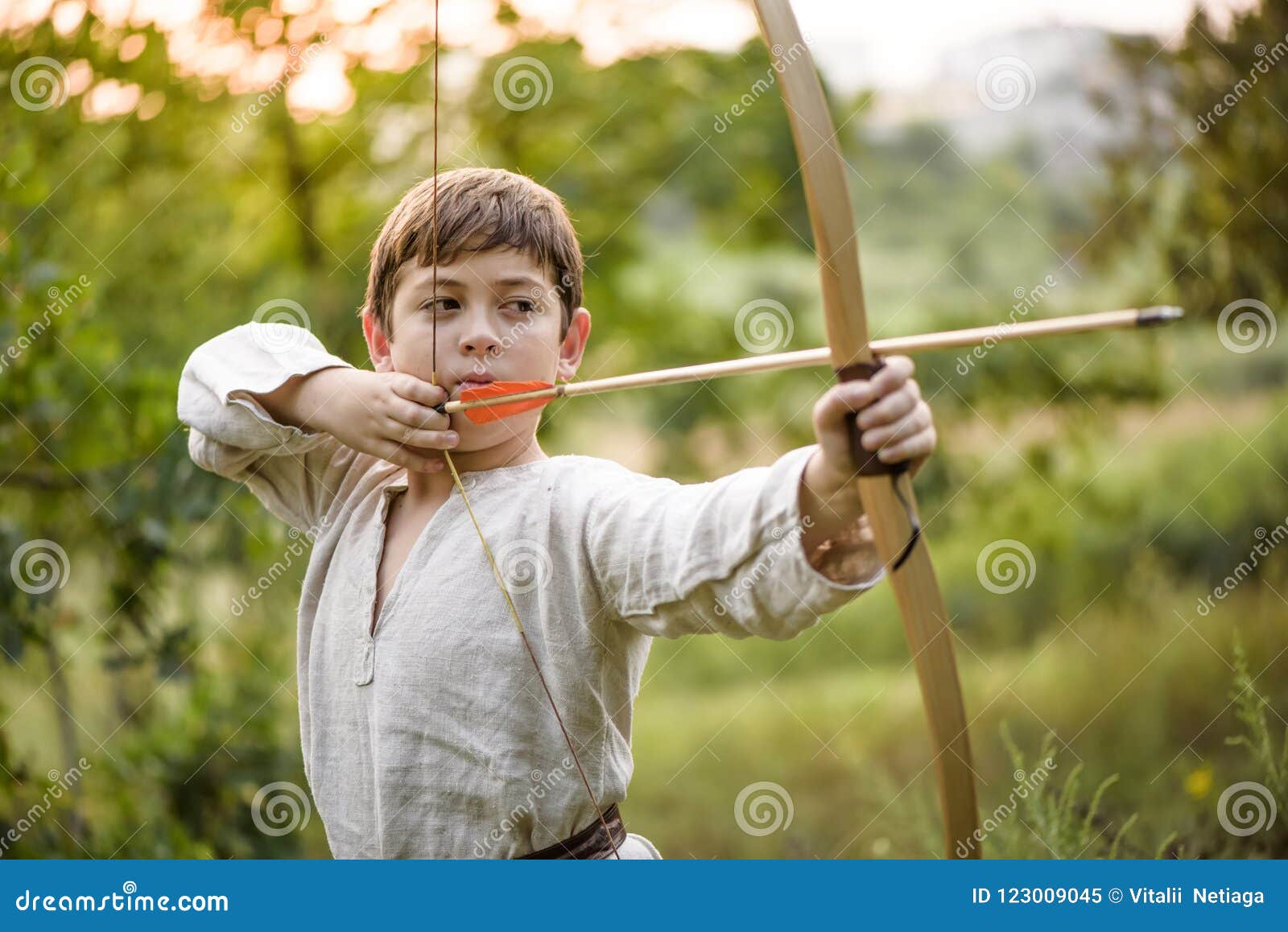 Young boy with a bow stock image. Image of target, outdoors - 123009045