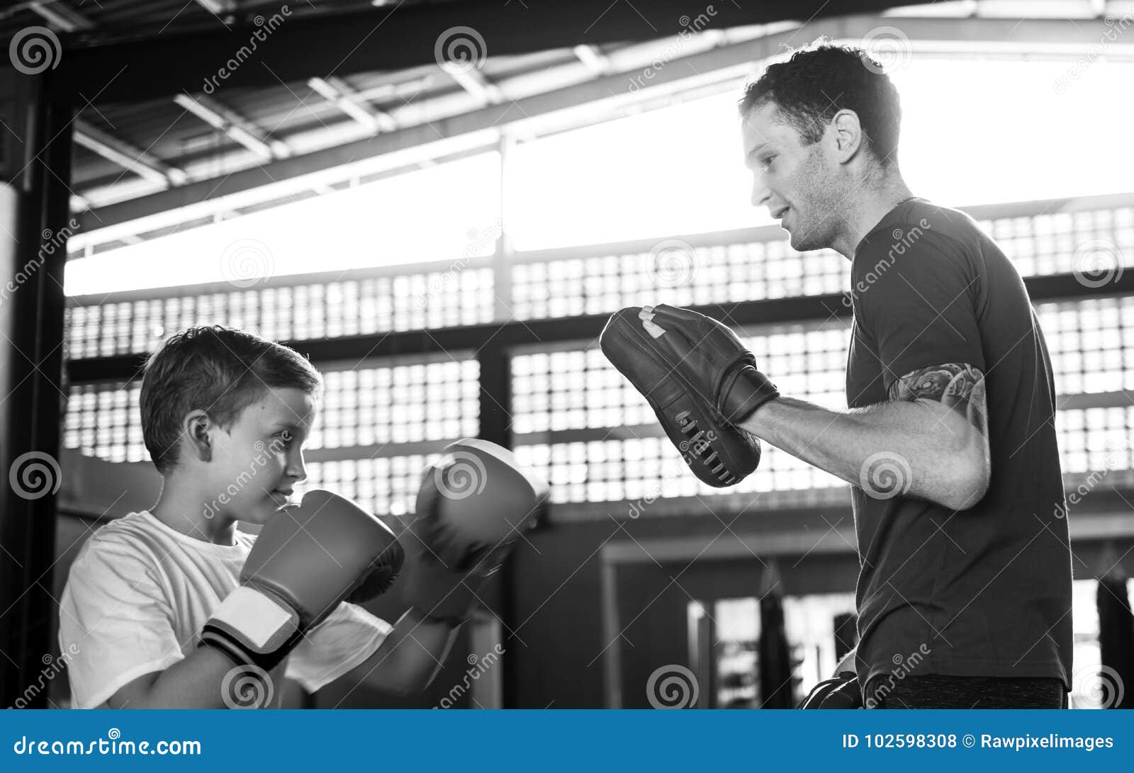 Young Boy Boxing with His Teacher Stock Photo - Image of handsome ...