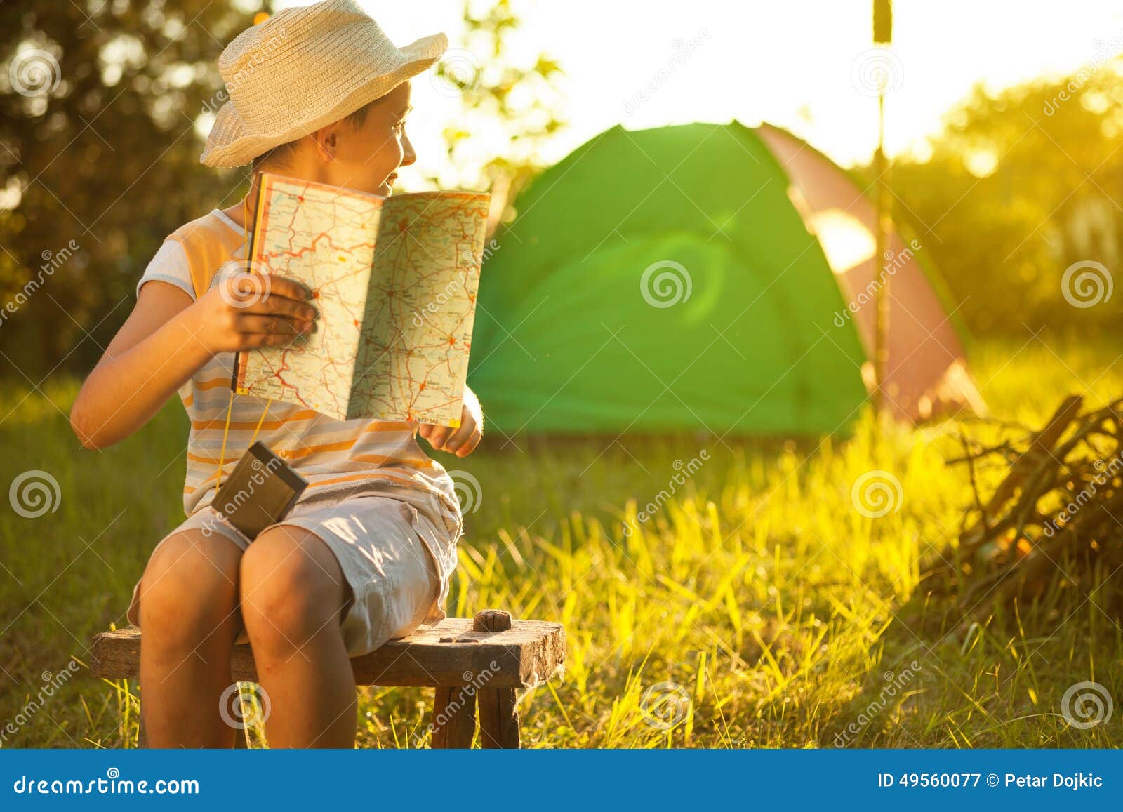 Young Boy on a Camping Trip Learning How To Read and Use a Map Stock ...