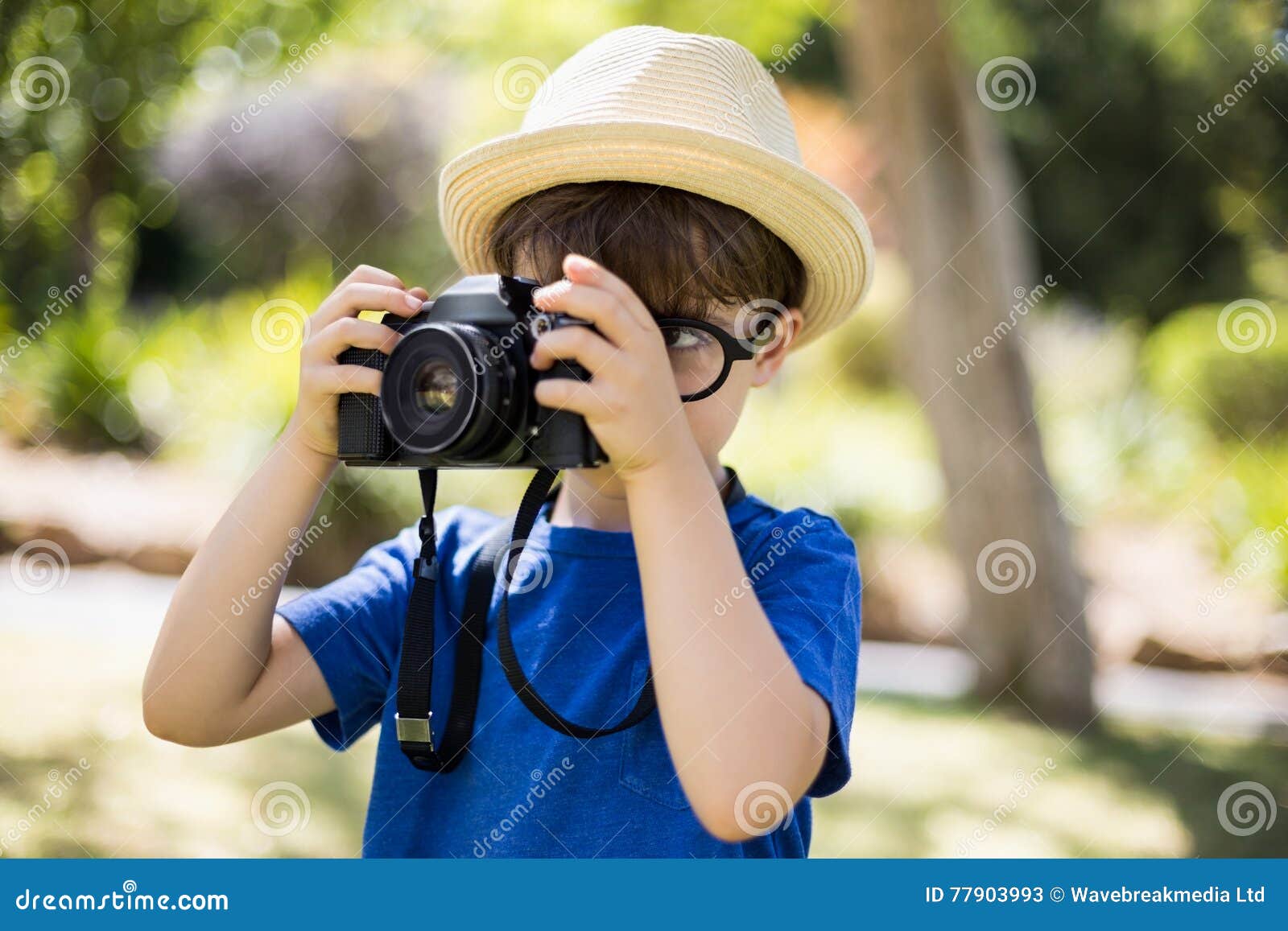 Young Boy Clicking a Photograph from Camera Stock Image - Image of ...