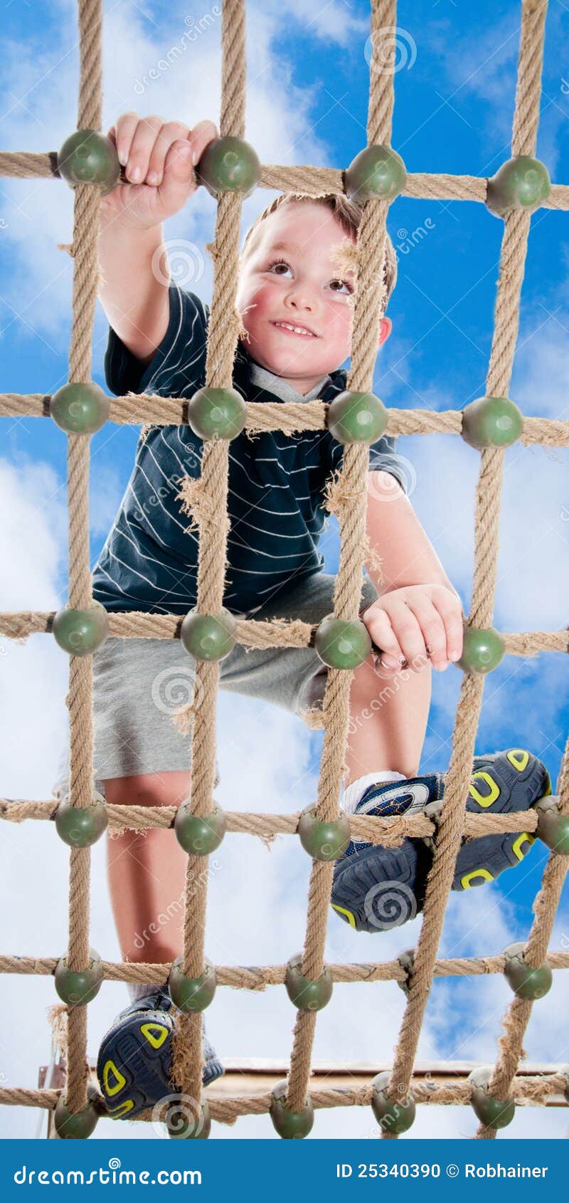 Young Boy Climbing Rope Obstacle Stock Photo - Image of toddler, face ...