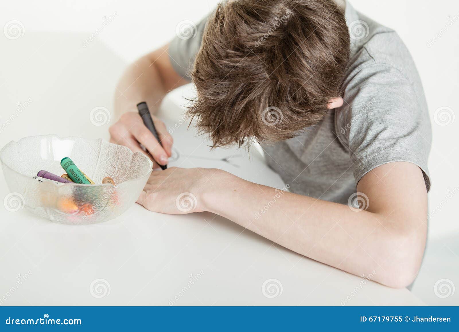 Young Boy Coloring His Drawing Using Crayons Royalty-Free Stock ...