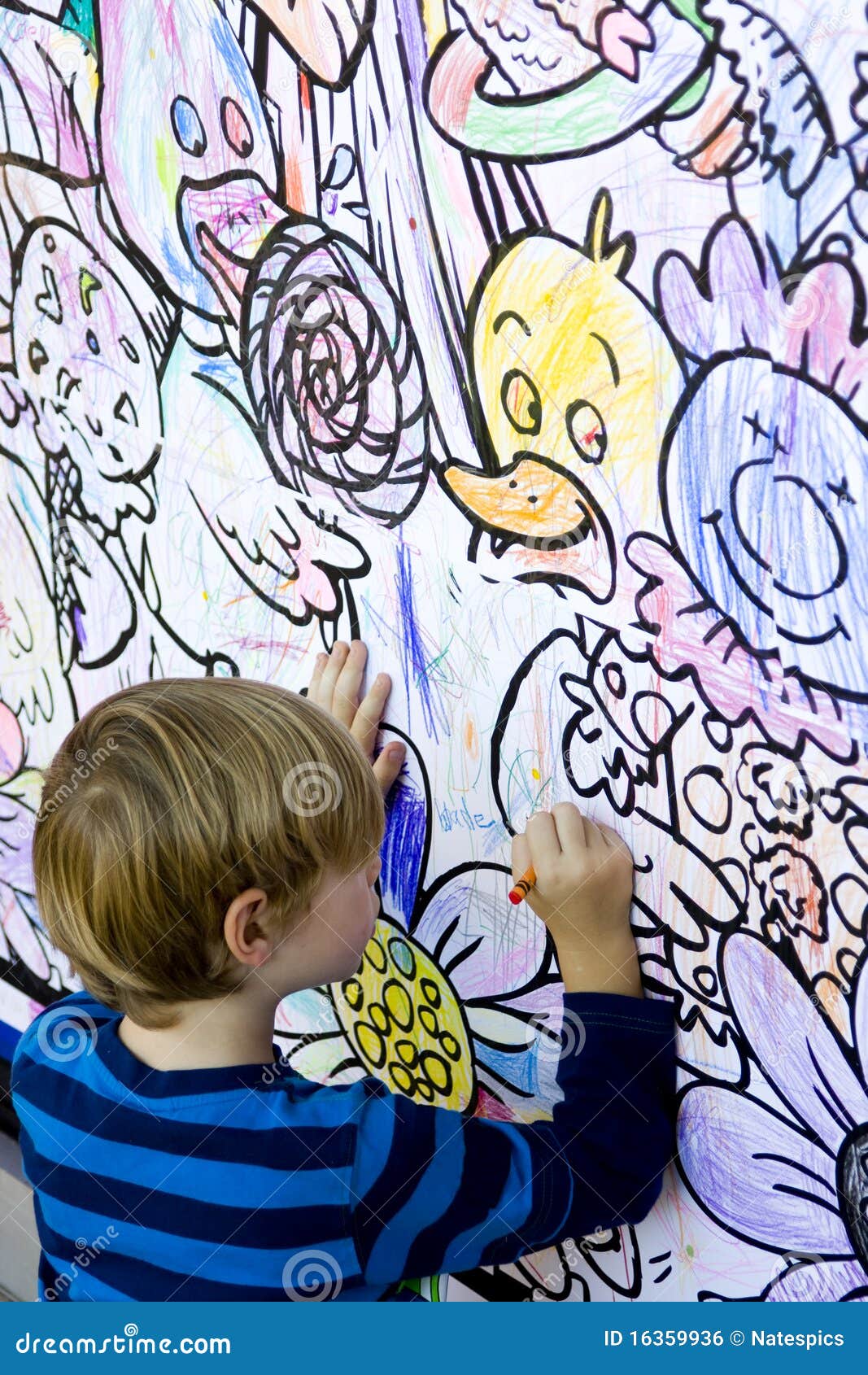 Young boy coloring a wall. stock photo. Image of youth - 16359936