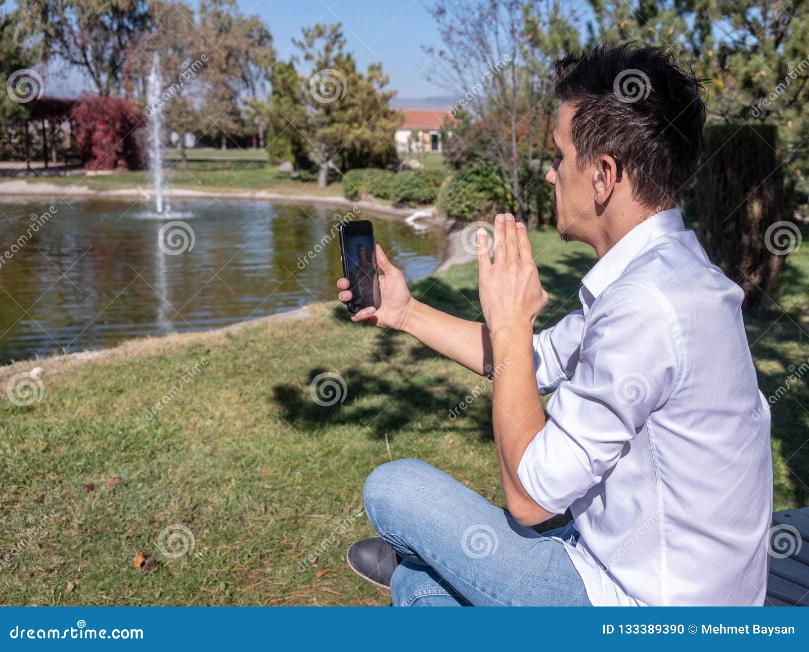 Young Boy Communicating with Sign Language at Smart Phone Stock Photo ...