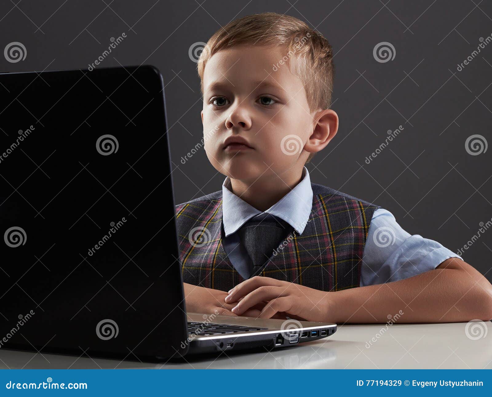 Young Boy with Computer. Funny Child Looking in Notebook Stock Image ...