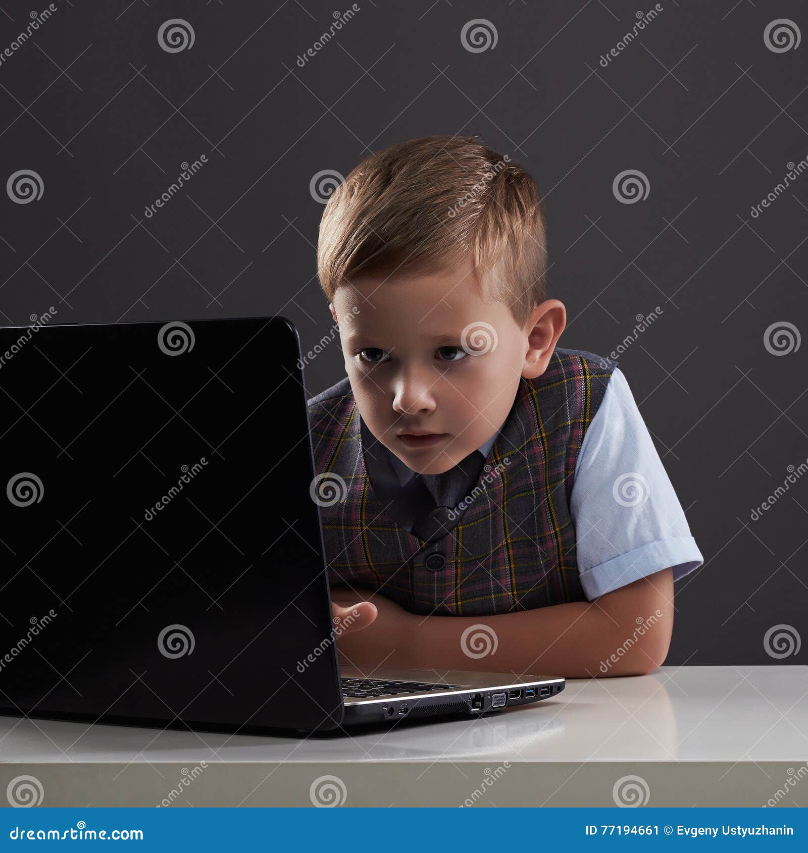 Young Boy with Computer. Funny Child Looking in Notebook Stock Image ...