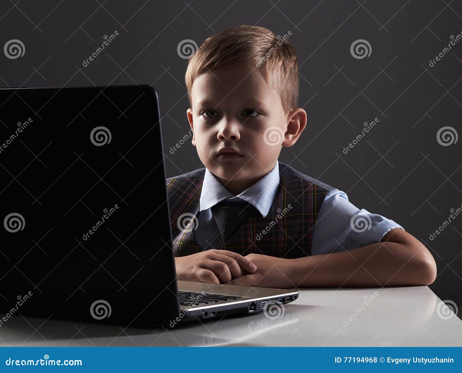 Young Boy with Computer. Funny Child Looking in Notebook Stock Photo ...