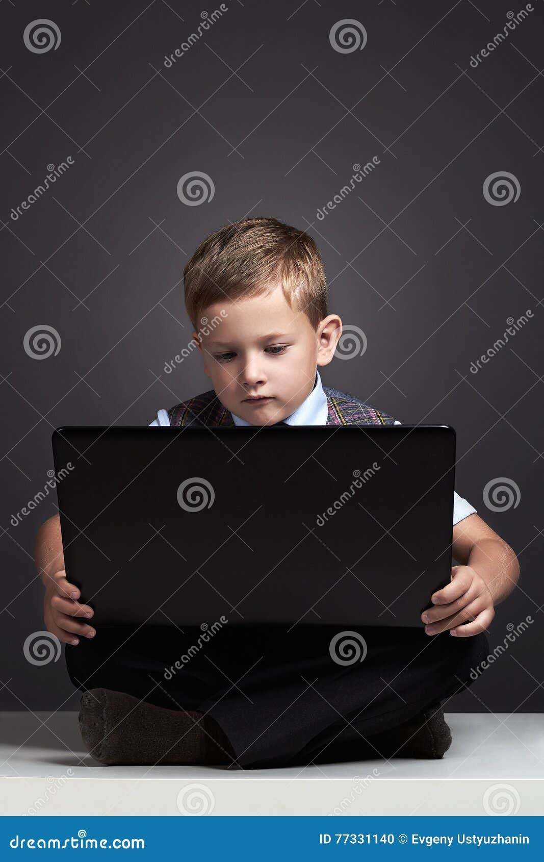 Young Boy with Computer. Funny Child Looking in Notebook Stock Photo ...