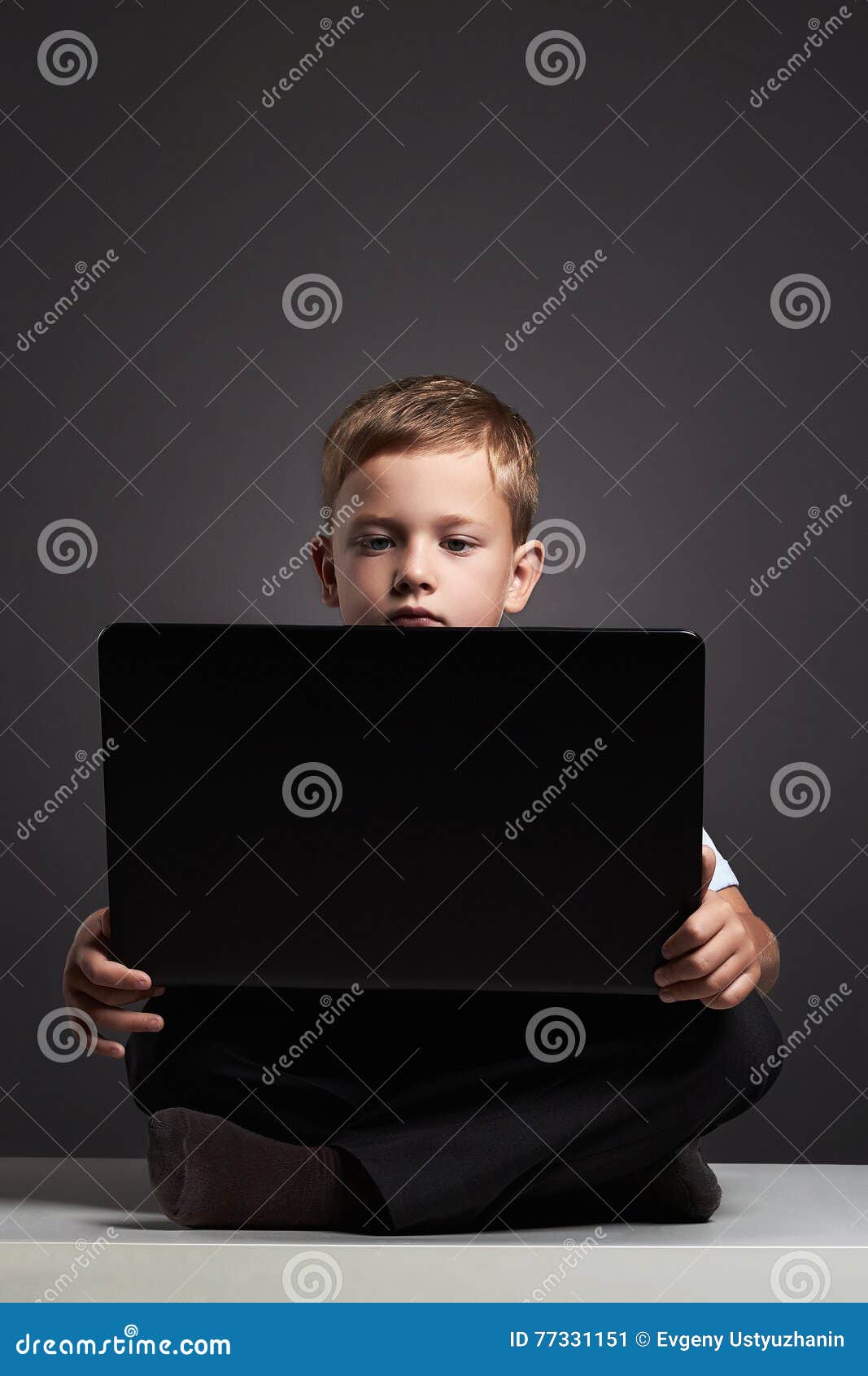 Young Boy with Computer. Funny Child Looking in Notebook Stock Image ...