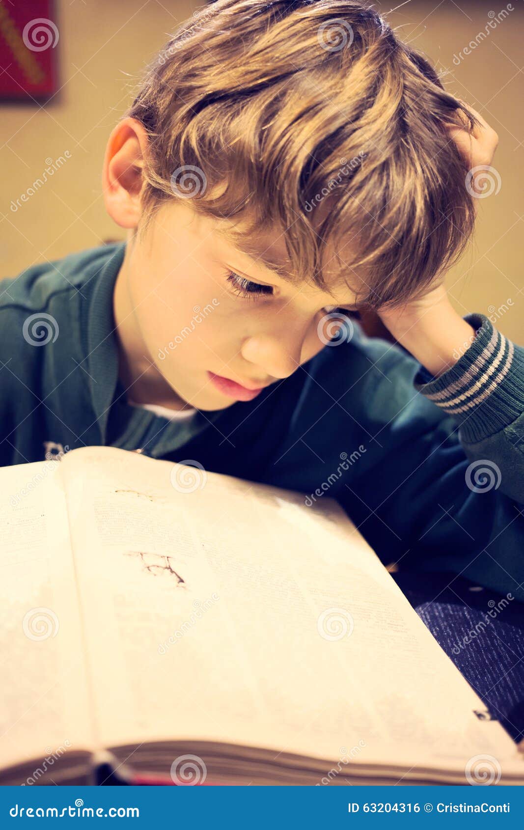 A Young Boy Concentrating on Homework Stock Photo - Image of hope ...