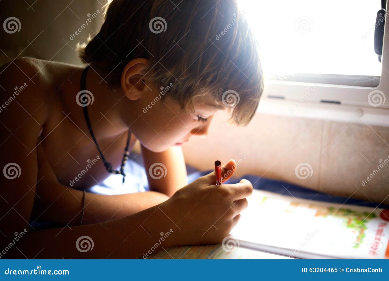 Young Boy Concentrating on Homework Stock Image - Image of caucasian ...