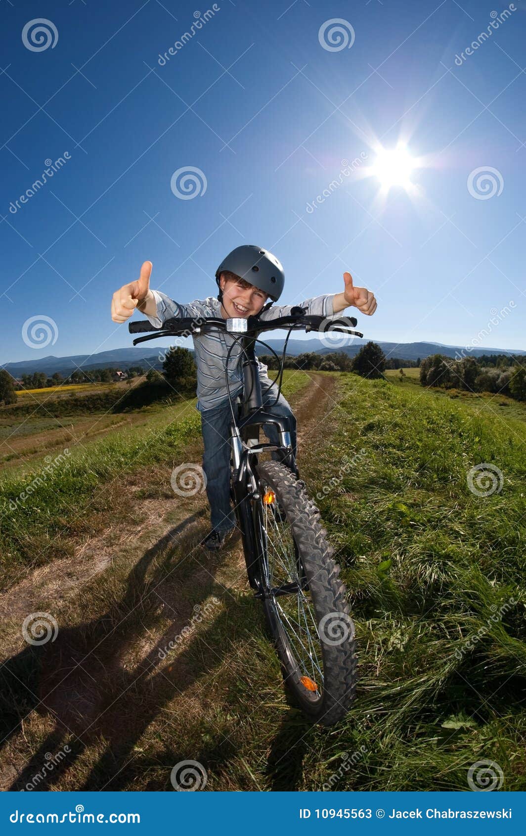 Young boy cycling stock image. Image of blue, action - 10945563