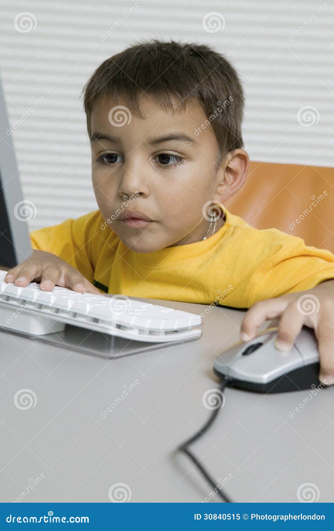 Young Boy at Desk Using Computer Close Up Stock Image - Image of ...
