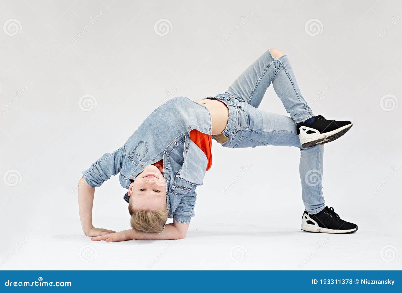 A Boy in an Unusual Breakdance Pose, Dance and Gymnastic Position Stock ...