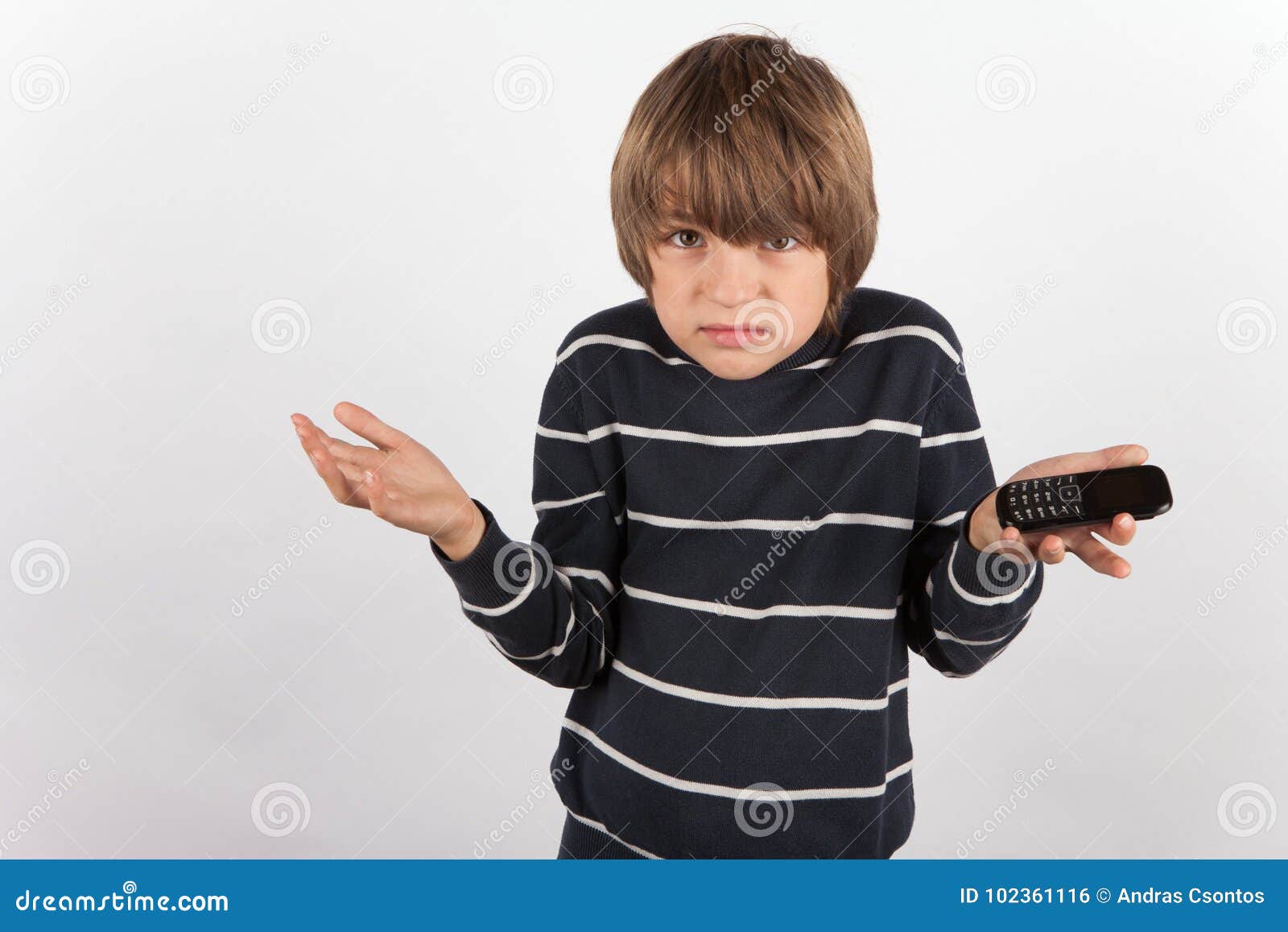 Young Boy Disappointed because he Has a Basic Mobile Phone only Stock ...