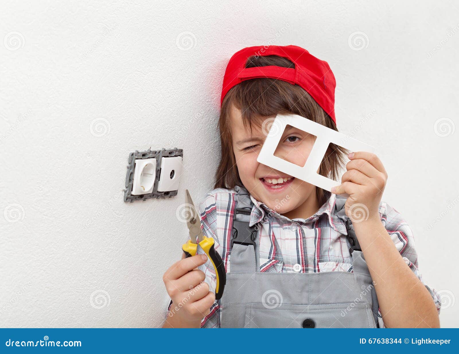 Young Boy Disassembling an Electrical Wall Fixture Stock Photo - Image ...