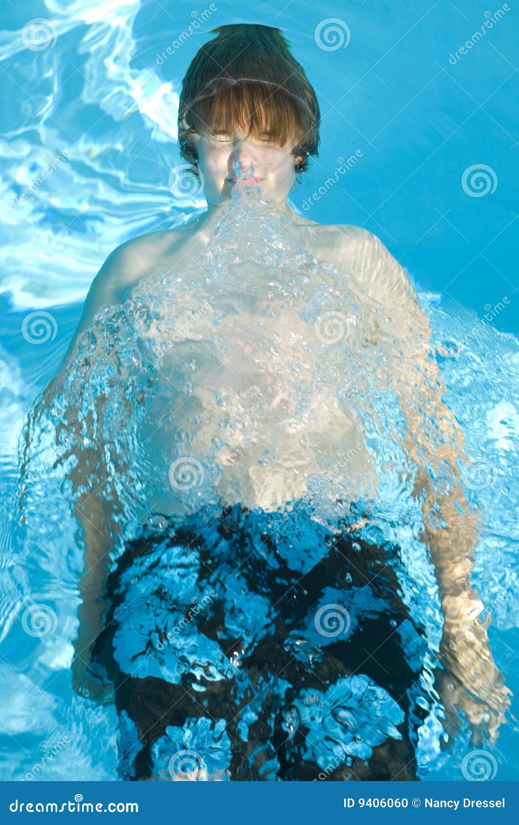 Young boy diving in pool stock photo. Image of activity - 9406060