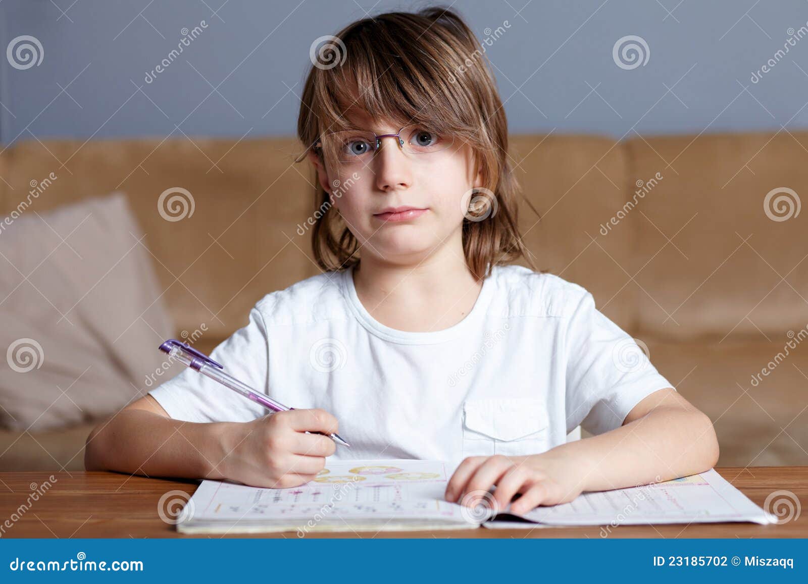 Young Boy Doing His Homework, Sitting at Table Stock Photo - Image of ...