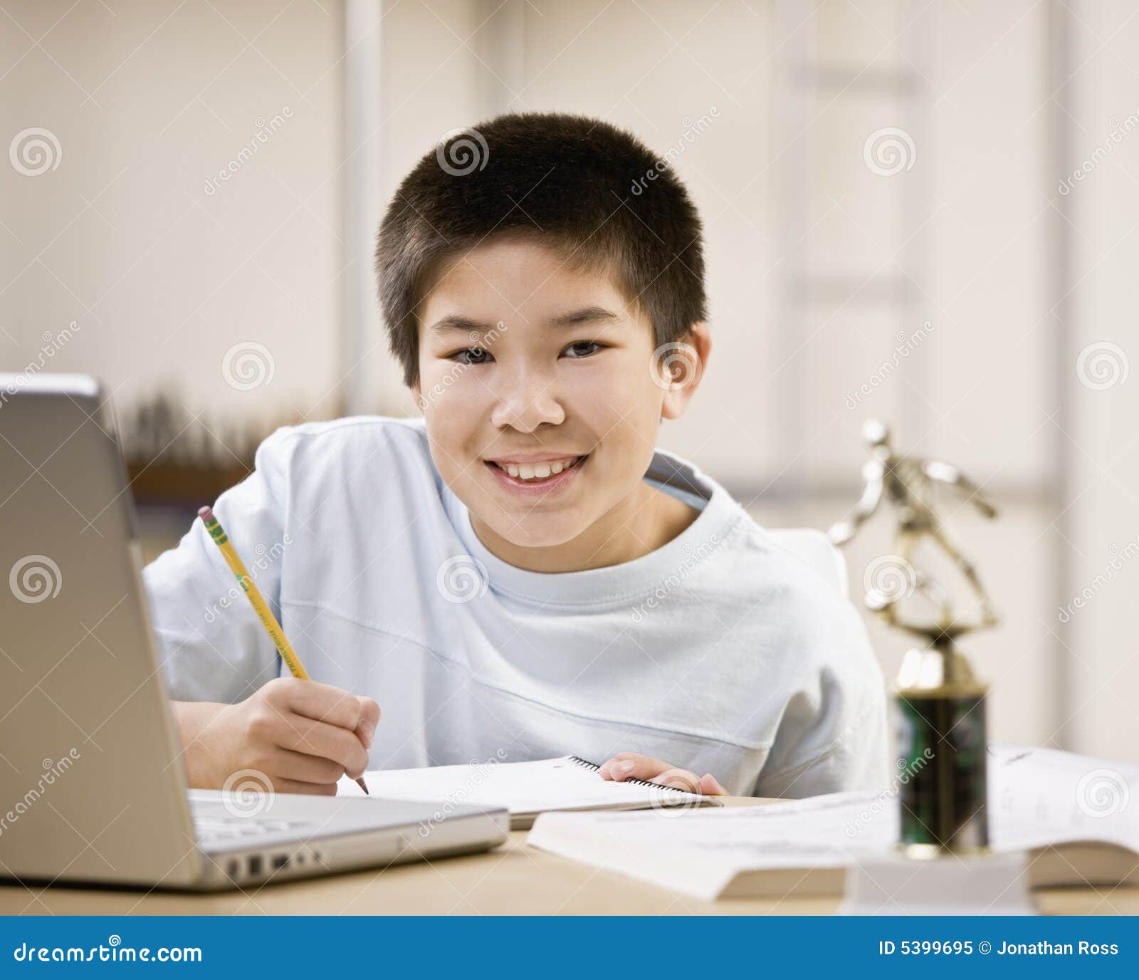 Young boy doing homework stock image. Image of internet - 5399695
