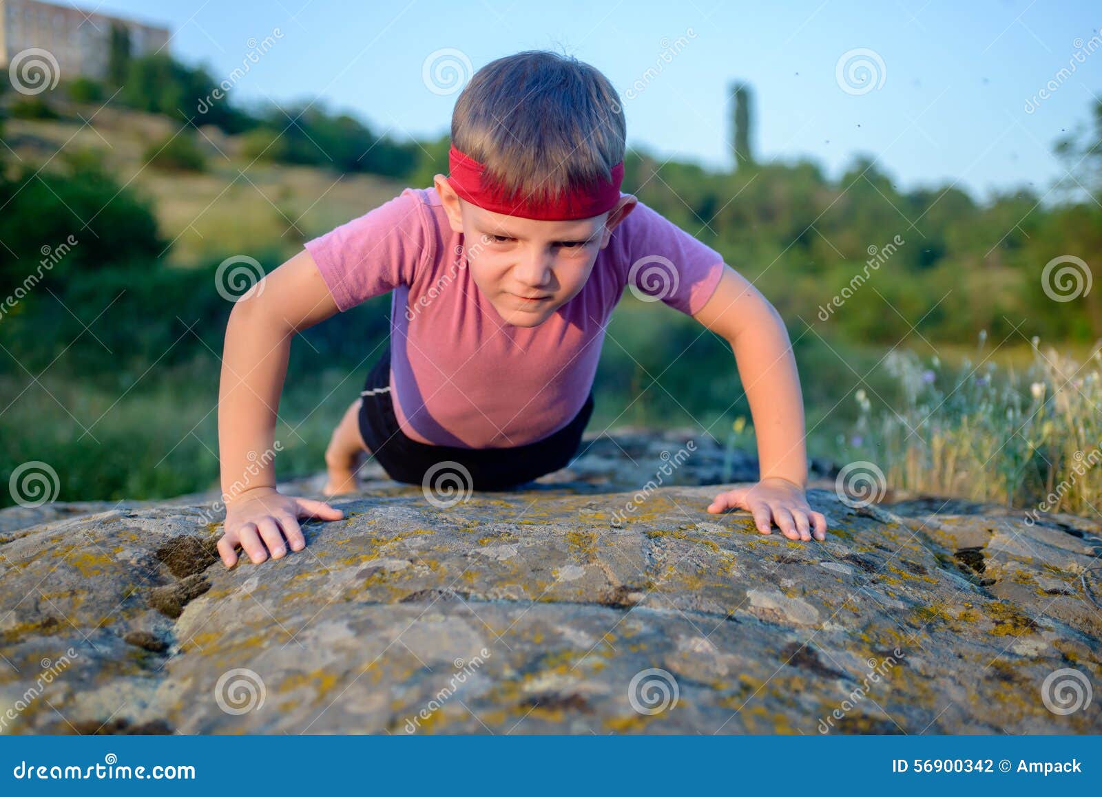 Young Boy Doing Push-ups on a Rock Stock Photo - Image of lifestyle ...