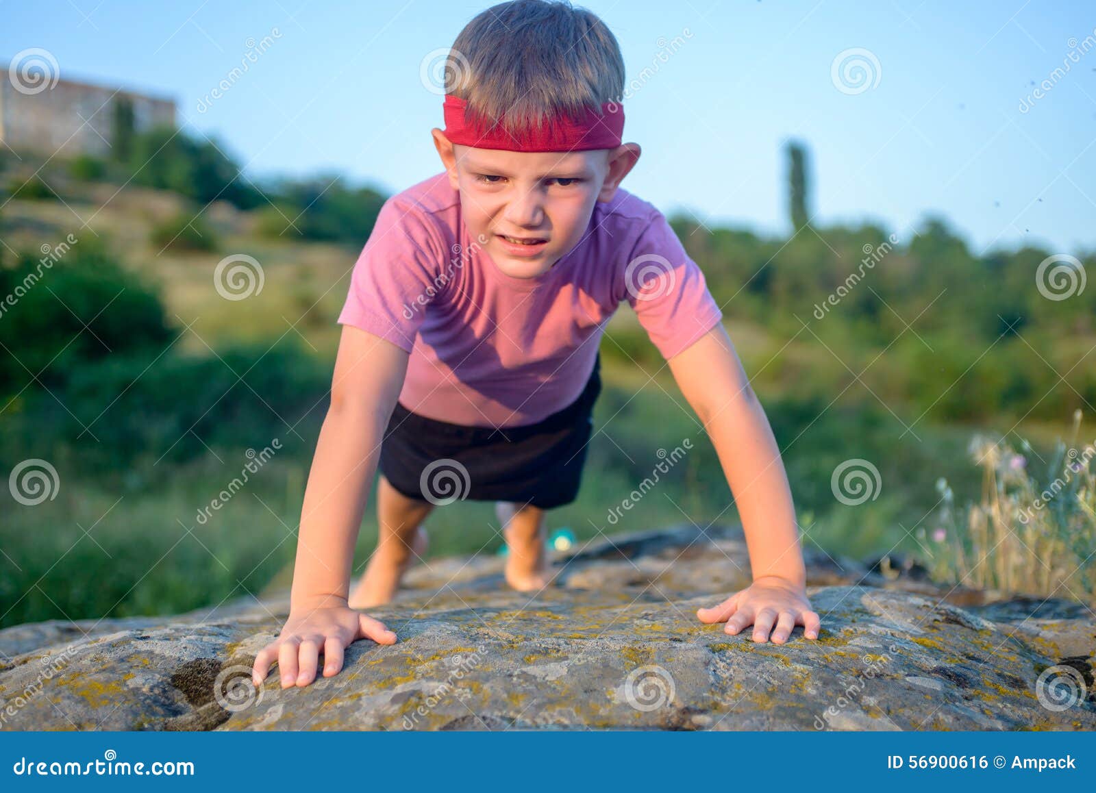Young Boy Doing Push-ups on a Rock Stock Photo - Image of strengthening ...