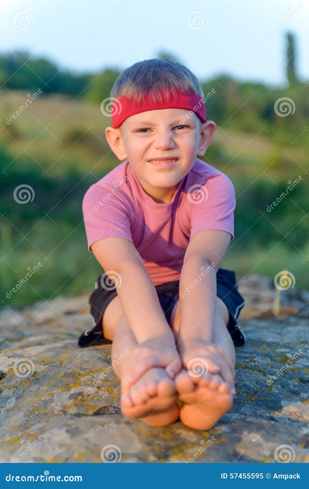 Young Boy Doing Stretching Exercises Stock Image - Image of childhood ...