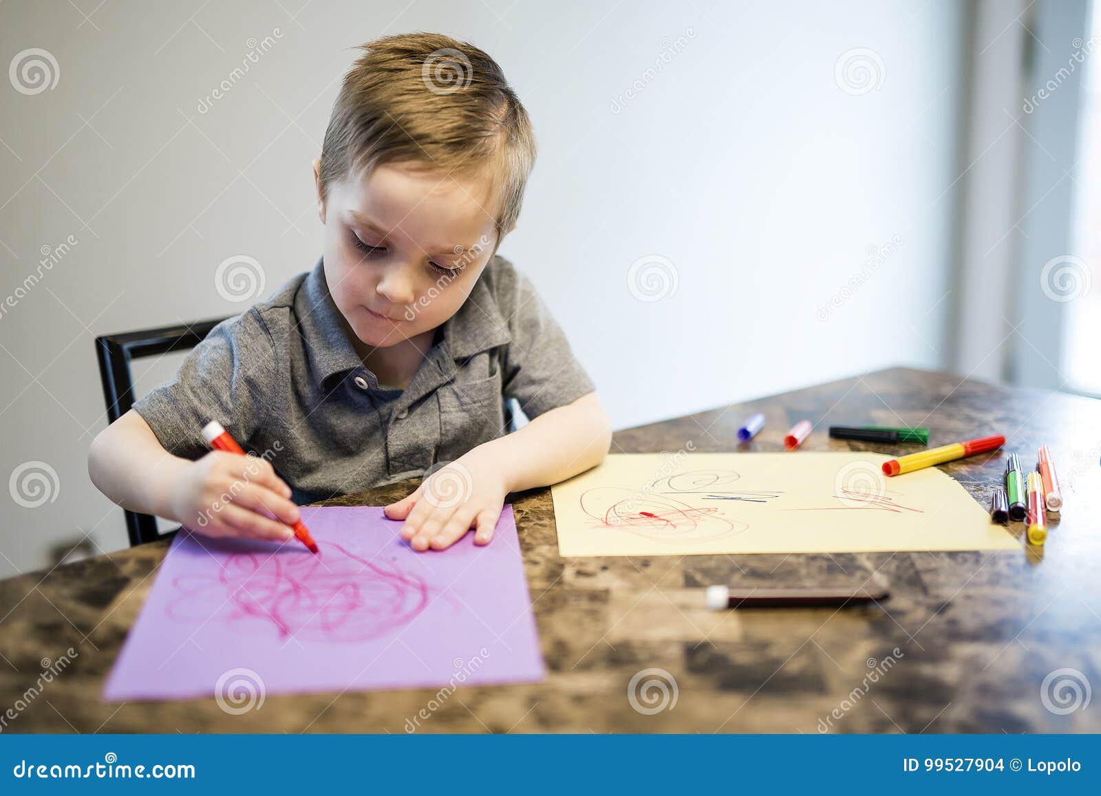 Young Boy Drawing on the Kitchen Table Stock Photo - Image of colored ...
