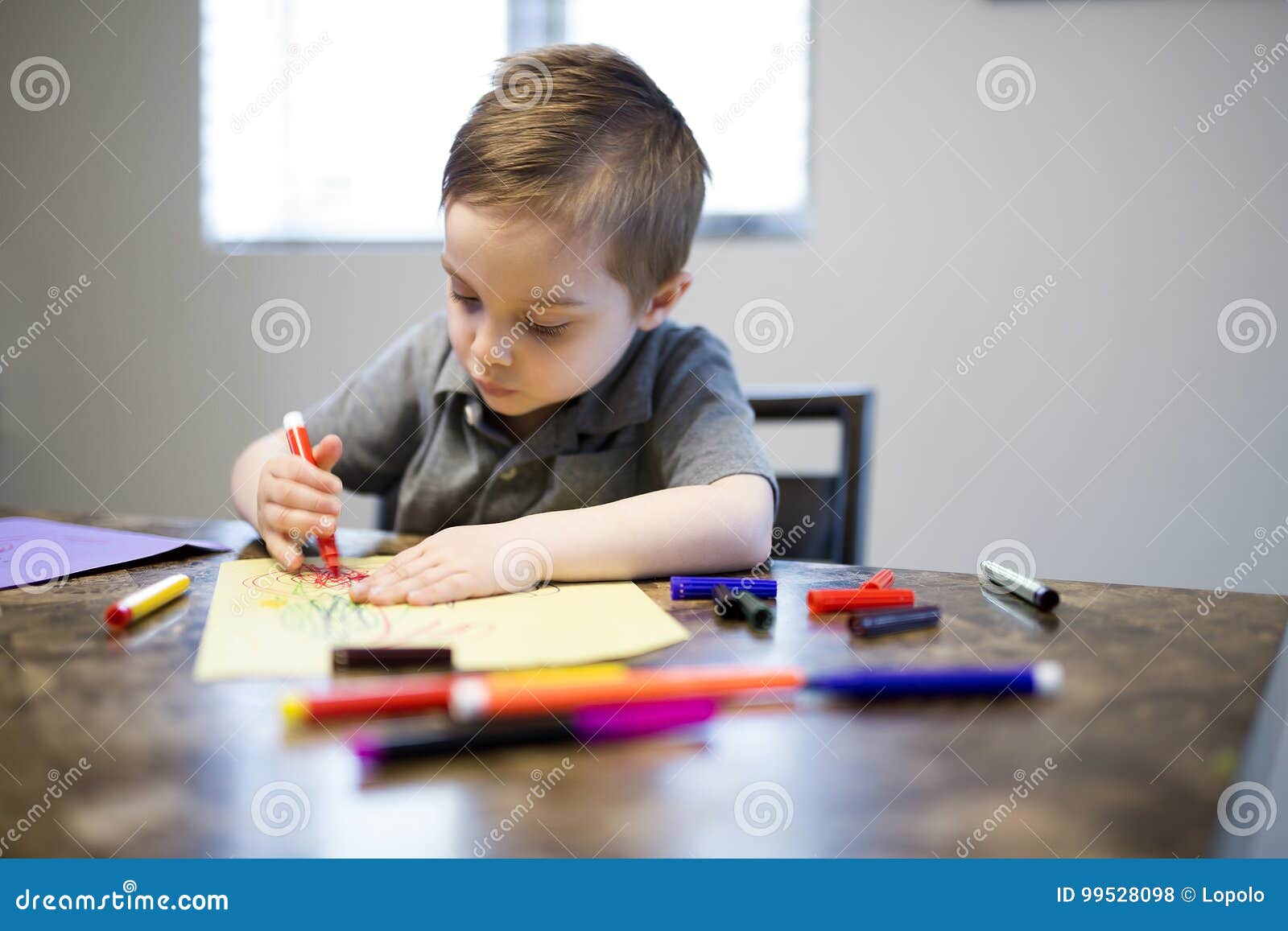 Young Boy Drawing on the Kitchen Table Stock Photo - Image of home ...