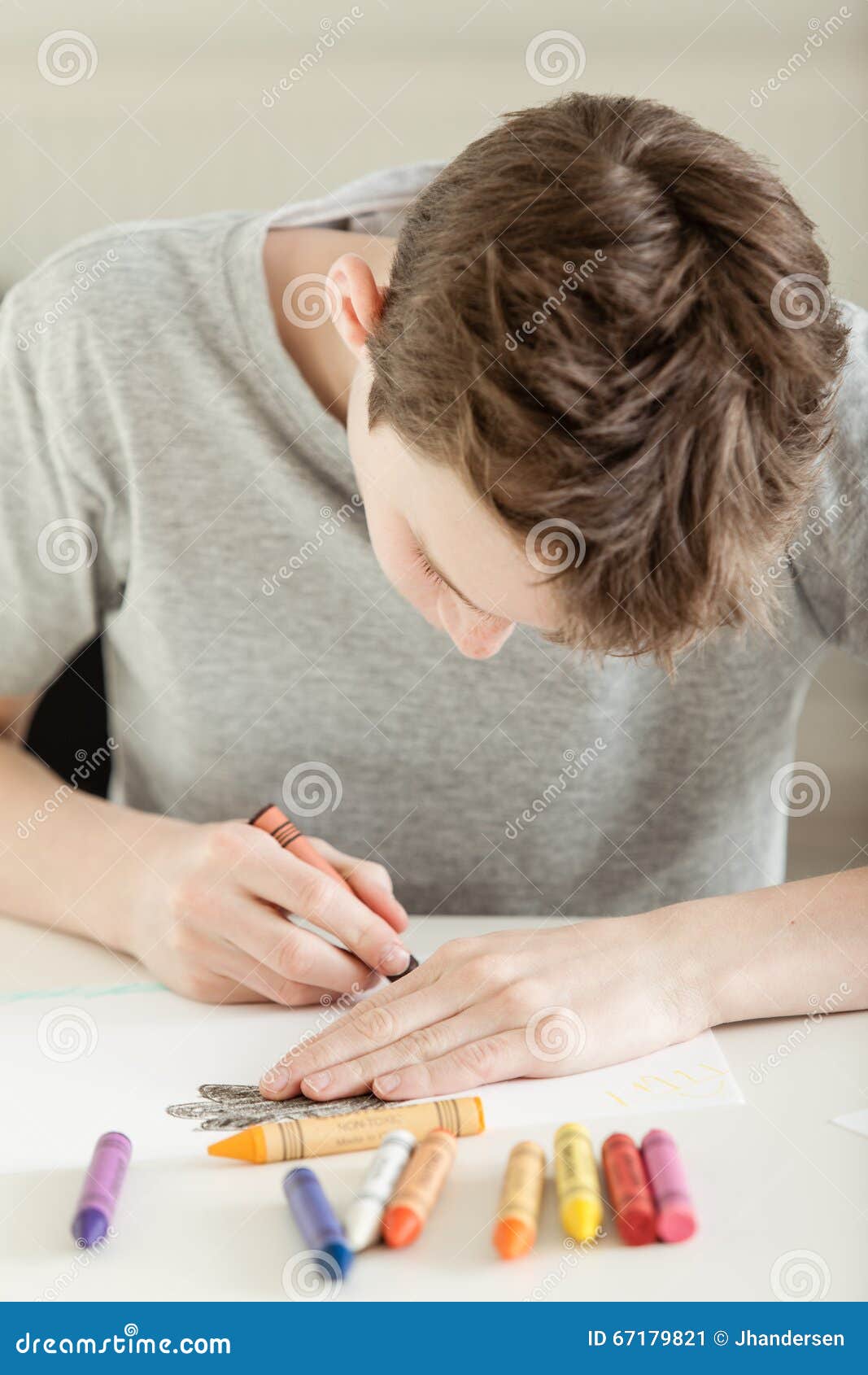Young Boy Drawing on White Paper with Crayons Stock Image - Image of ...