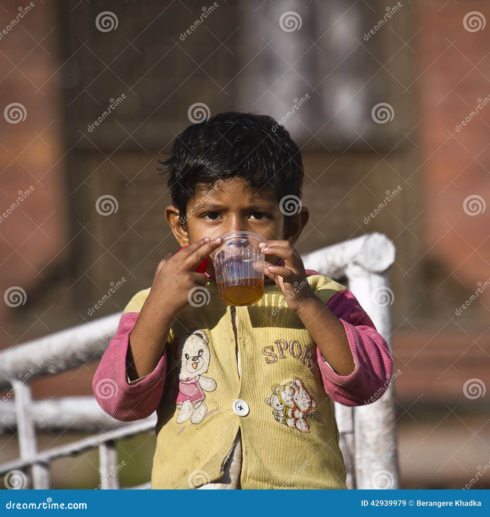 A Young Boy is Drinking a Cup of Tea Editorial Stock Image - Image of ...