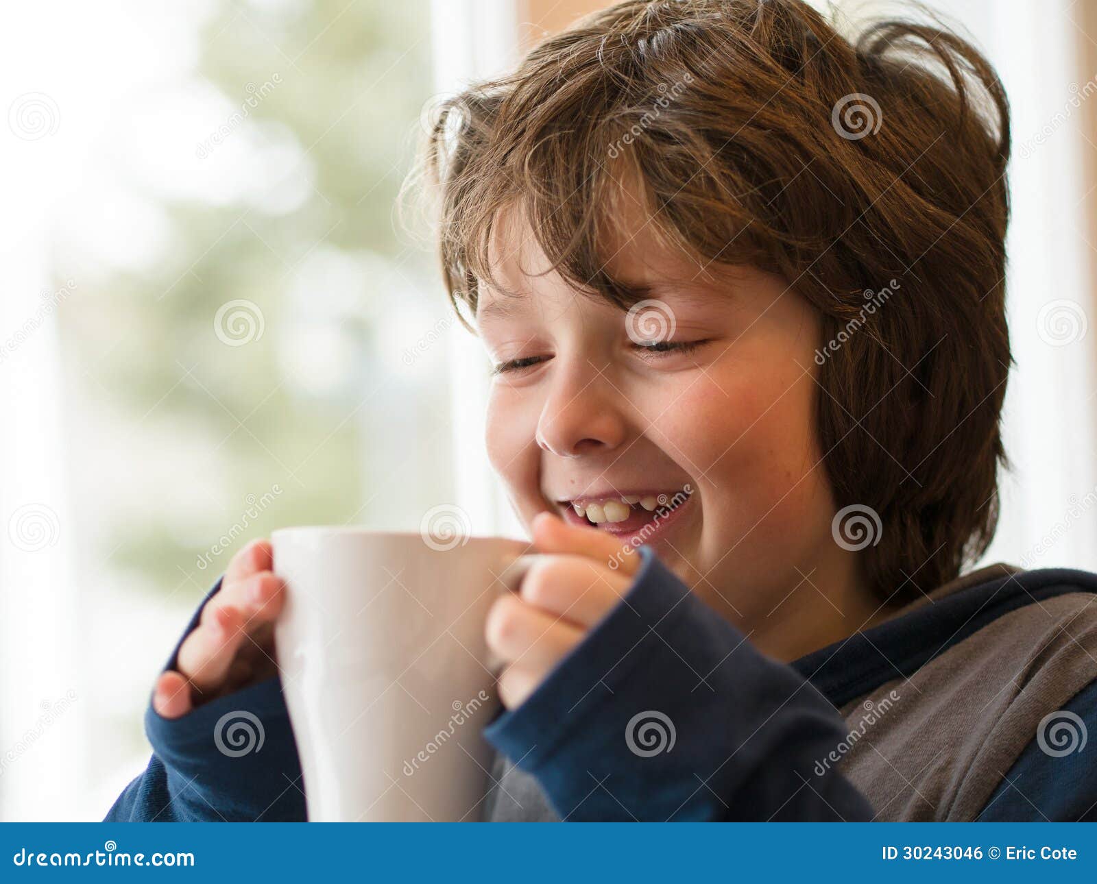 Boy drinking hot chocolate stock photo. Image of youth - 30243046