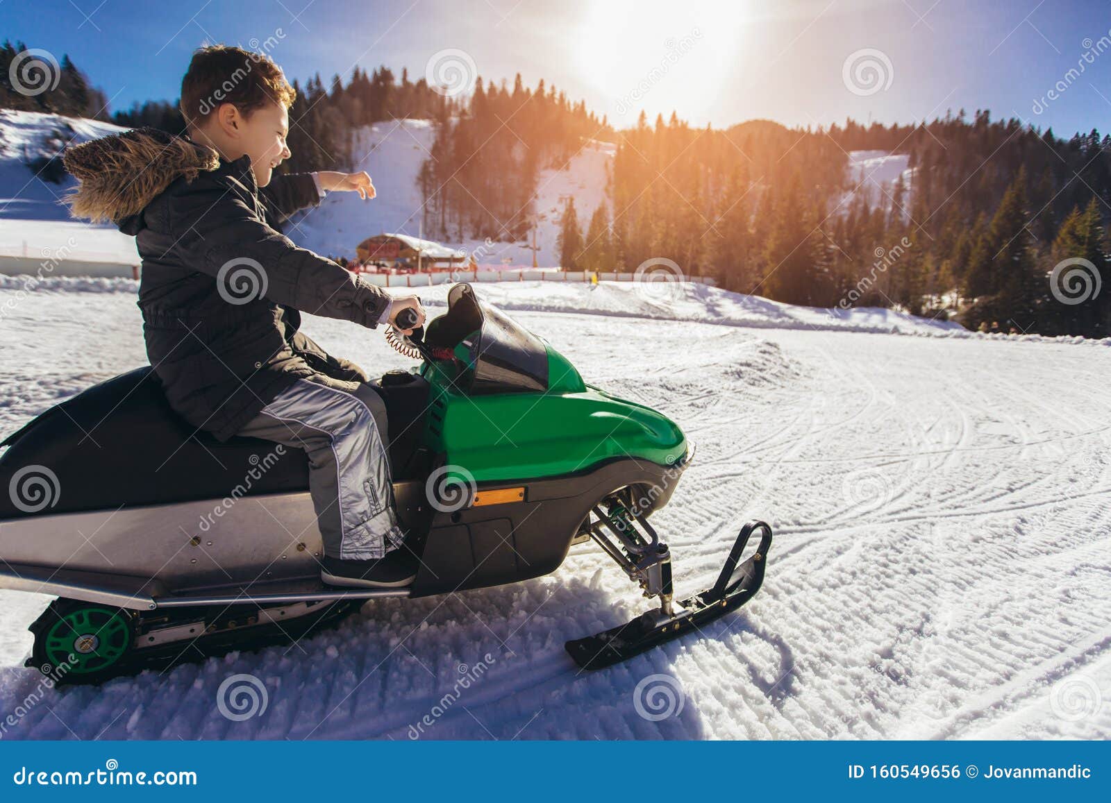 Boy Driving Snowmobile in a Winter Landscape Stock Photo - Image of ...