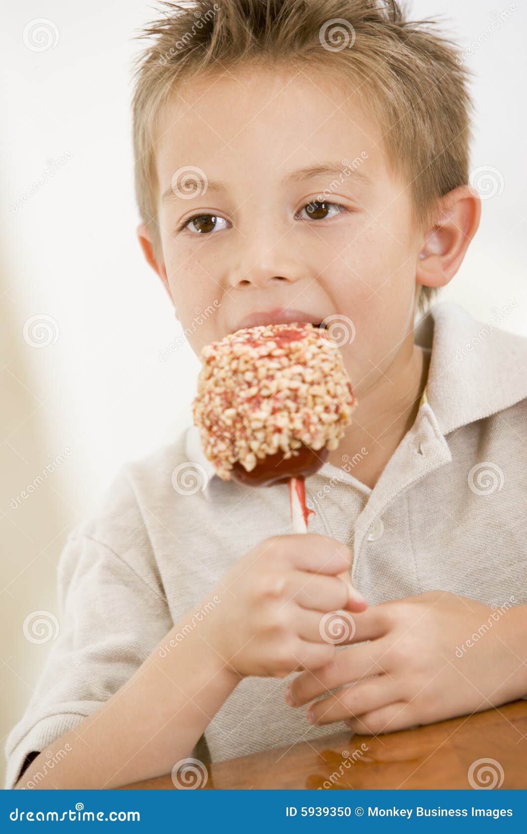 Young Boy Eating Candy Apple Stock Photo - Image of snack, kids: 5939350