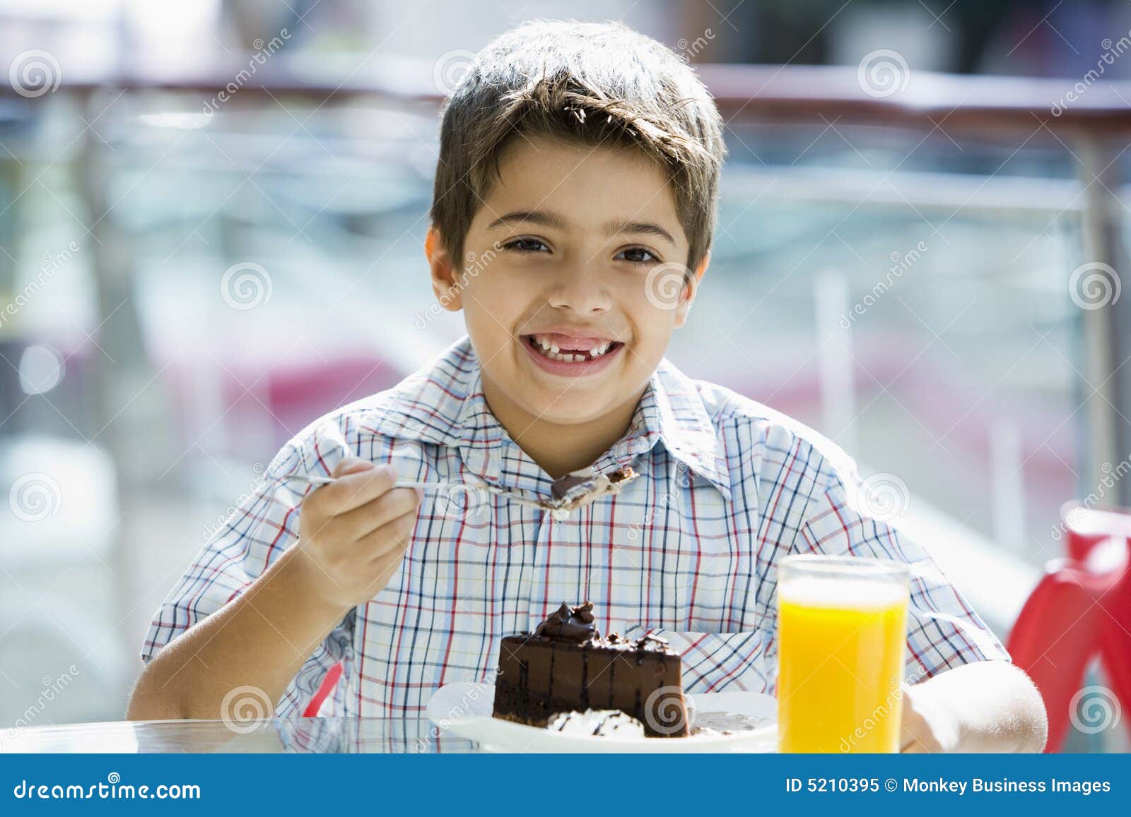 Young Boy Eating Chocolate Cake in Cafe Stock Image - Image of glass ...