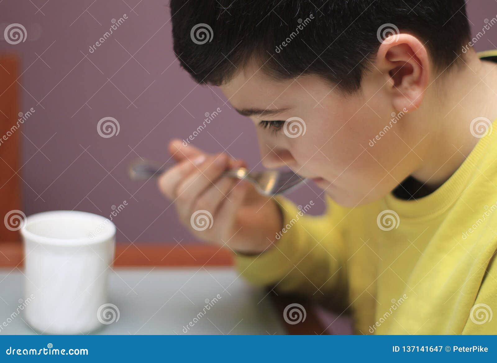 Young Boy Eating with a Fork at the Table Stock Image - Image of meat ...