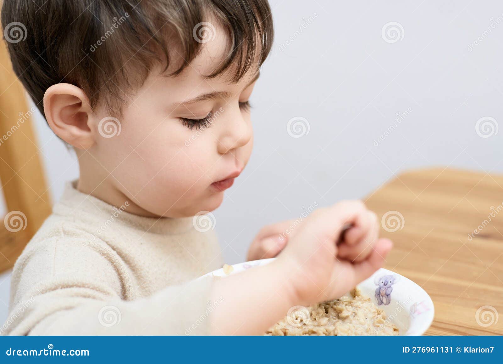 Young Boy Eating Oatmeal for Breakfast Stock Image - Image of hungry ...