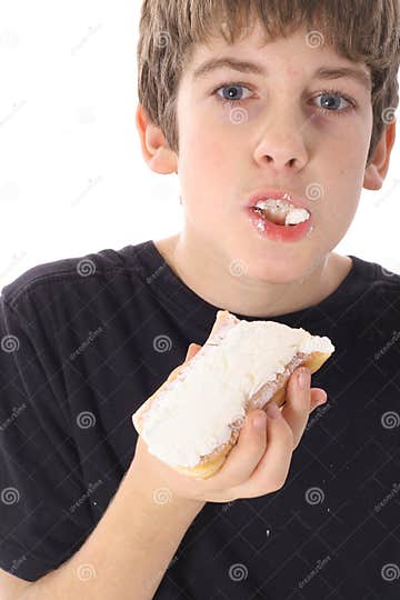 Young boy eating a pastry stock photo. Image of baked - 6239860