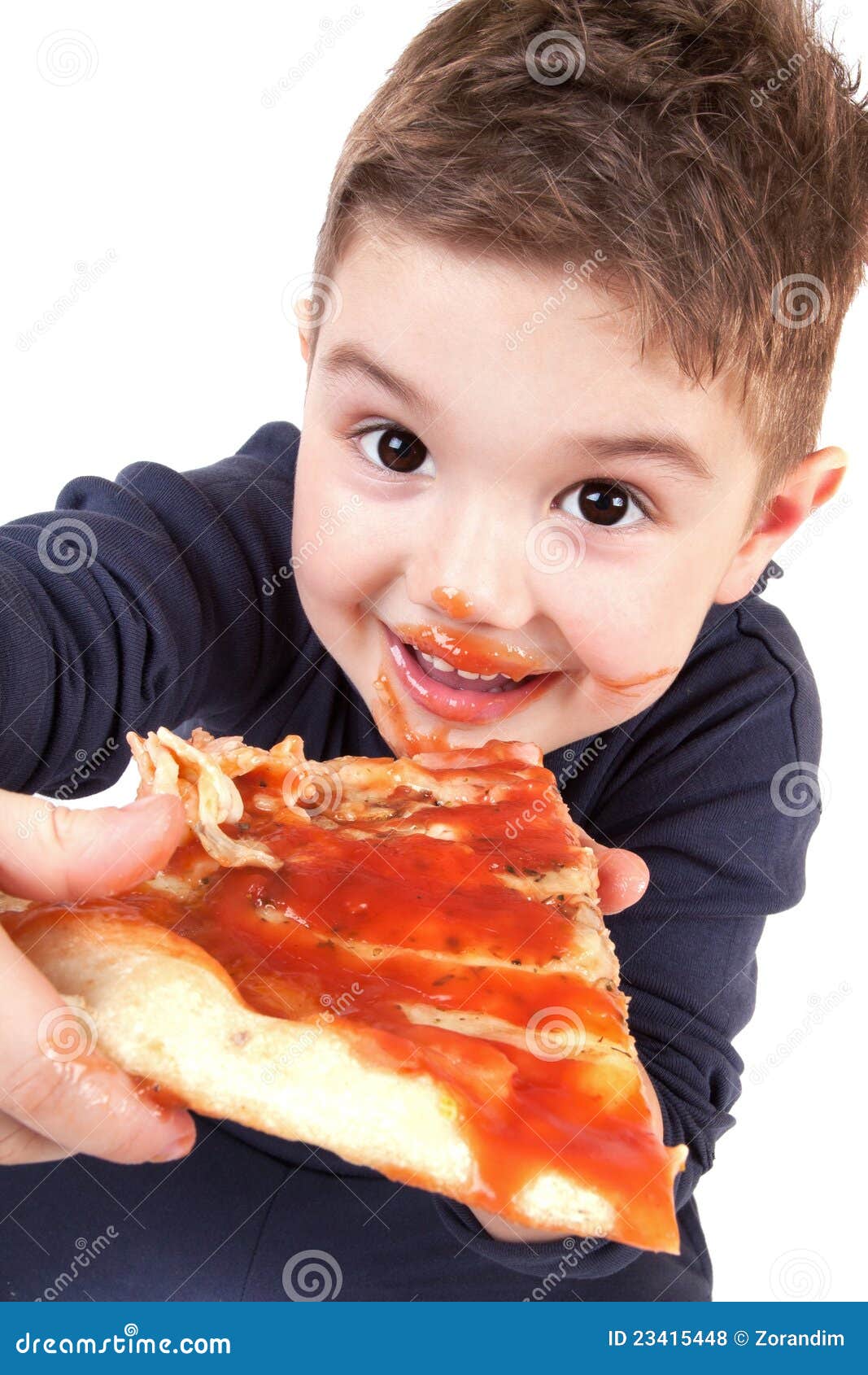 A young boy eating pizza stock photo. Image of hand, portrait - 23415448