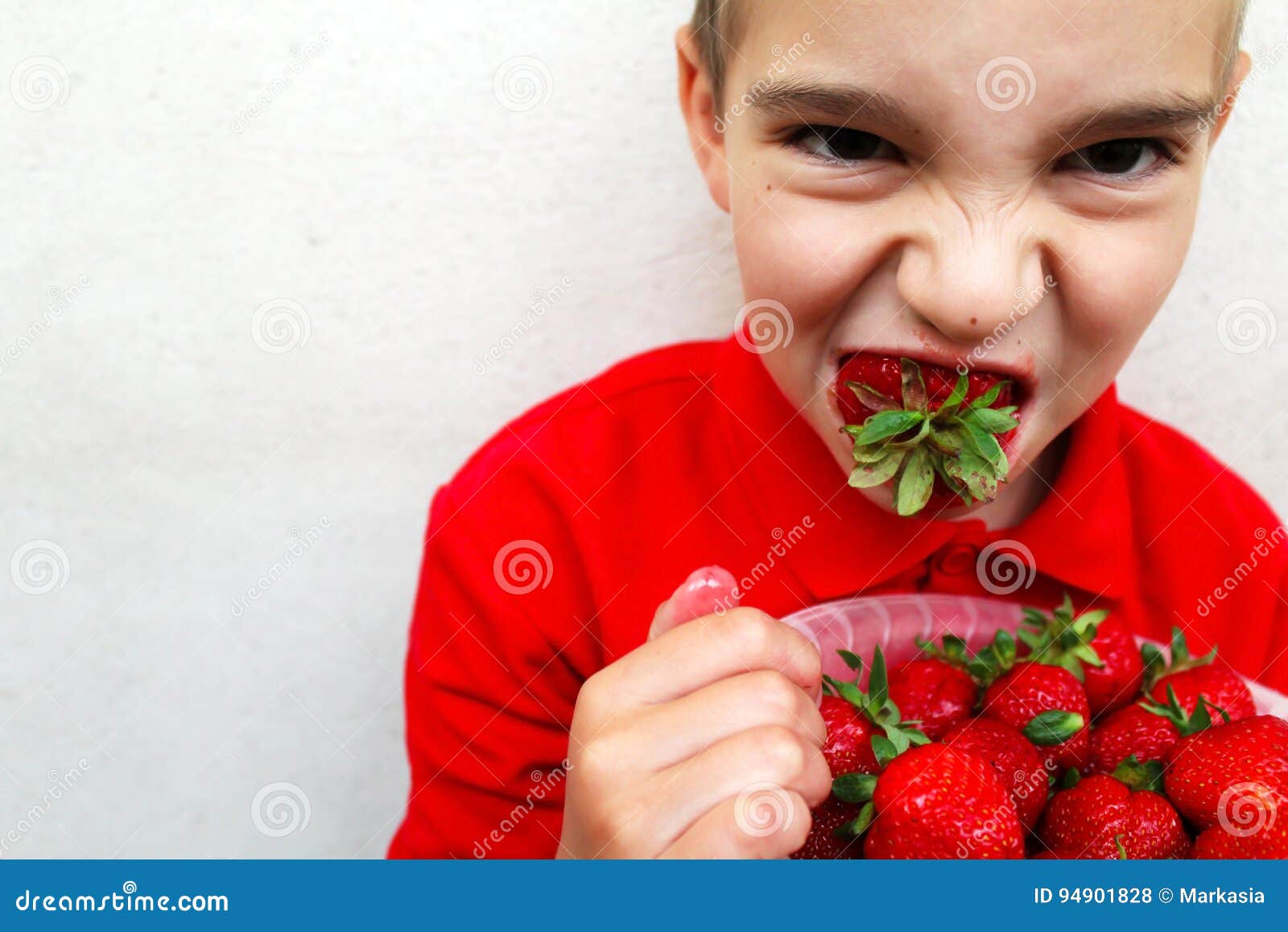 Young Boy Eating a Ripe Strawberry. Stock Photo - Image of humor, sour ...