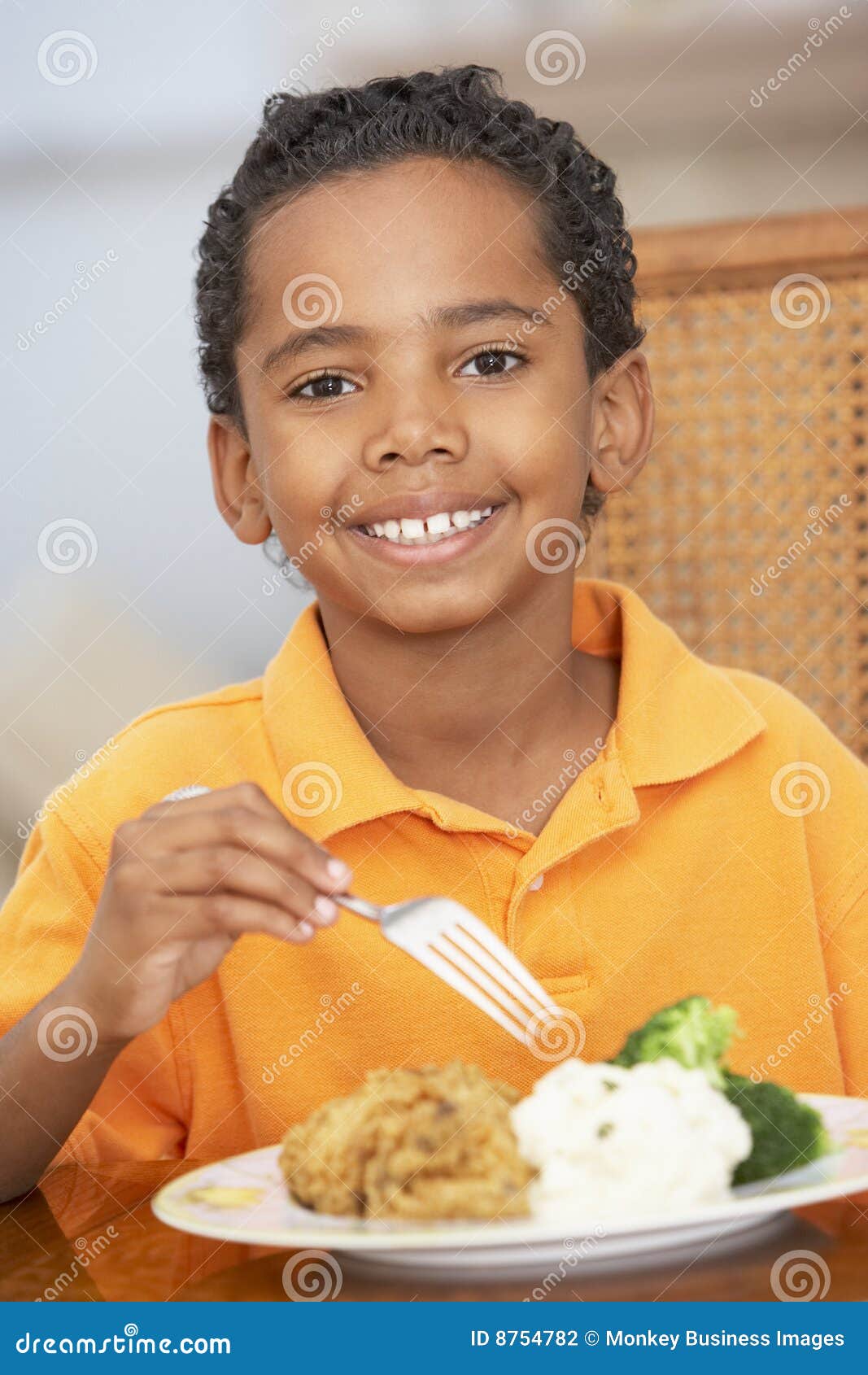 Young Boy Enjoying a Meal at Home Stock Photo - Image of camera ...