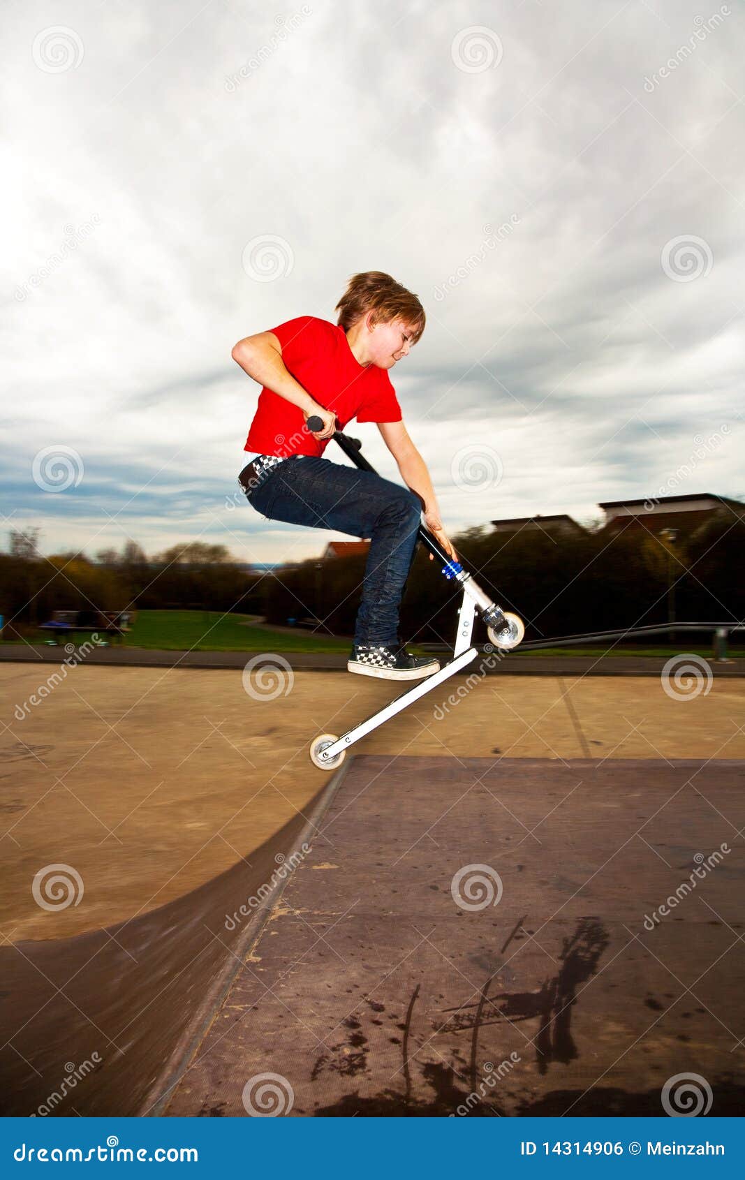 Young Boy Enjoys Riding a Scooter Stock Photo - Image of ramp, jump ...
