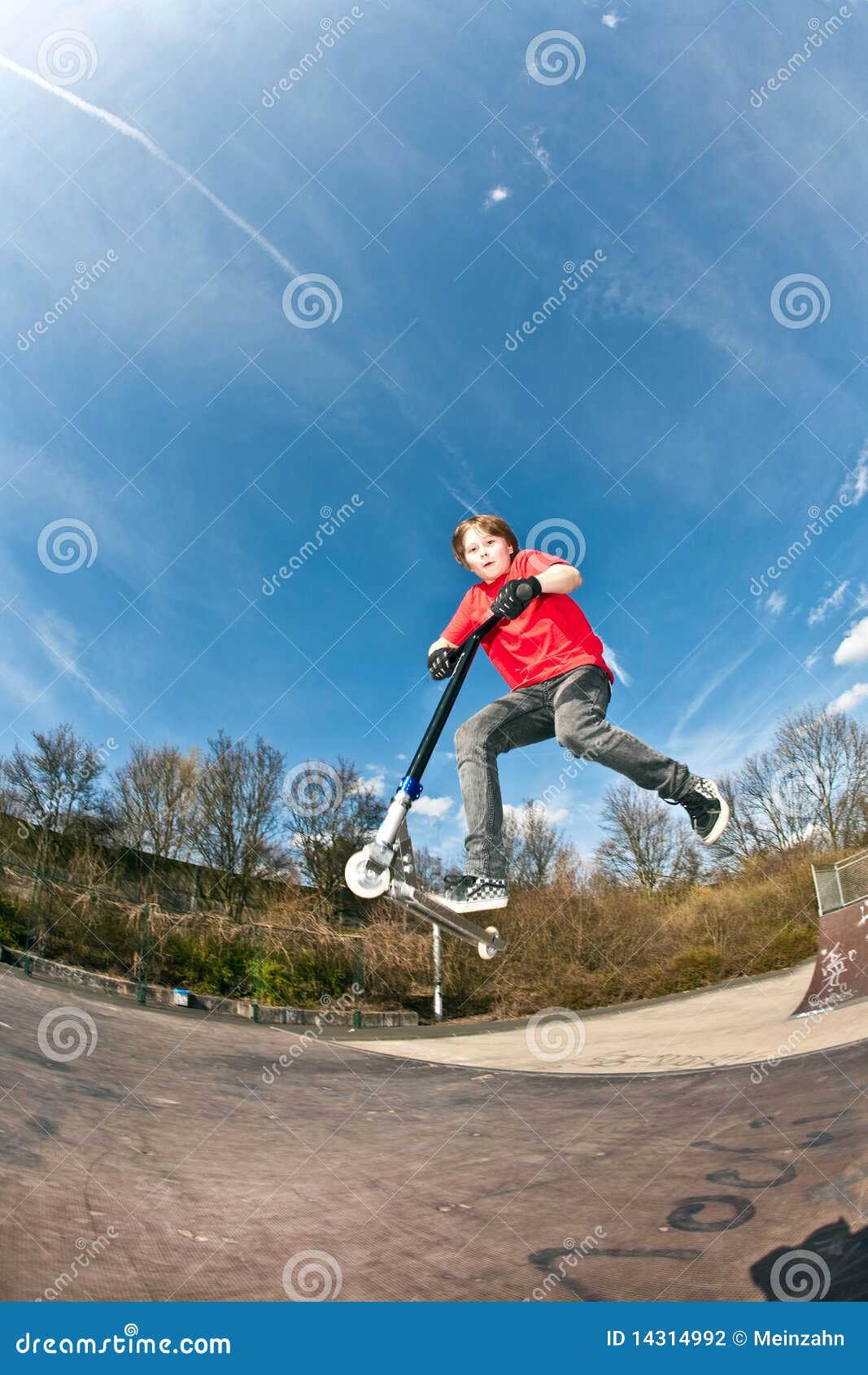 Young Boy Enjoys Riding a Scooter Stock Photo - Image of brown, play ...