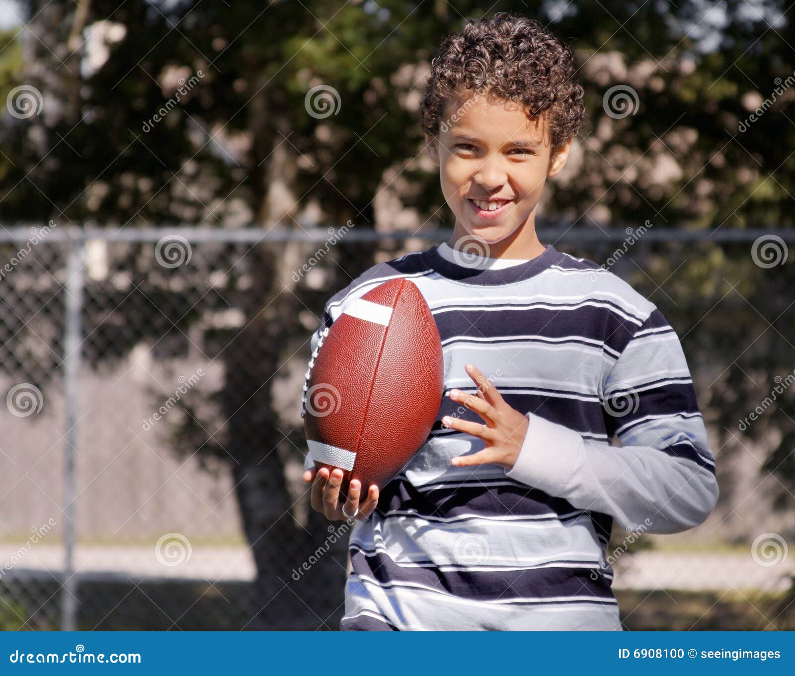 Young boy with football stock photo. Image of autumn, casual - 6908100