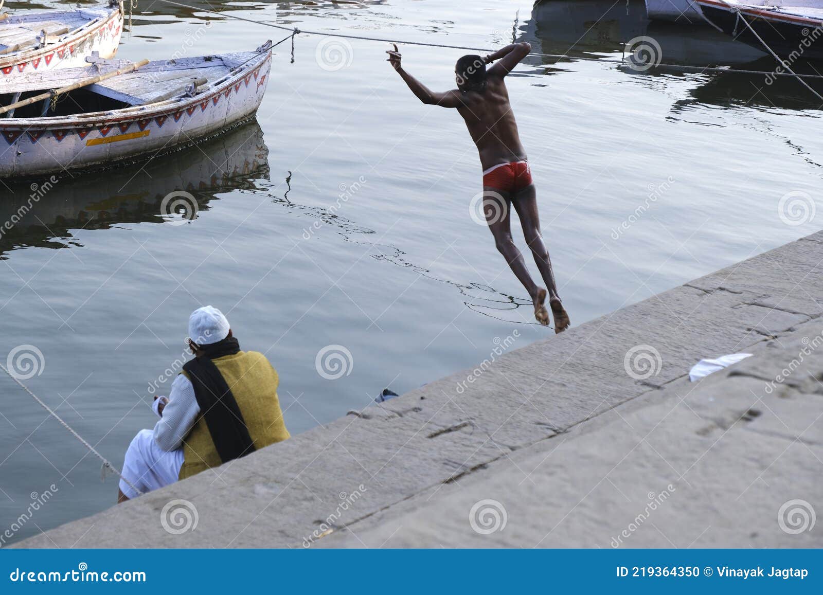 Young Men Jumping & Swimming in Holy Ganga River, Varanasi, Uttar ...