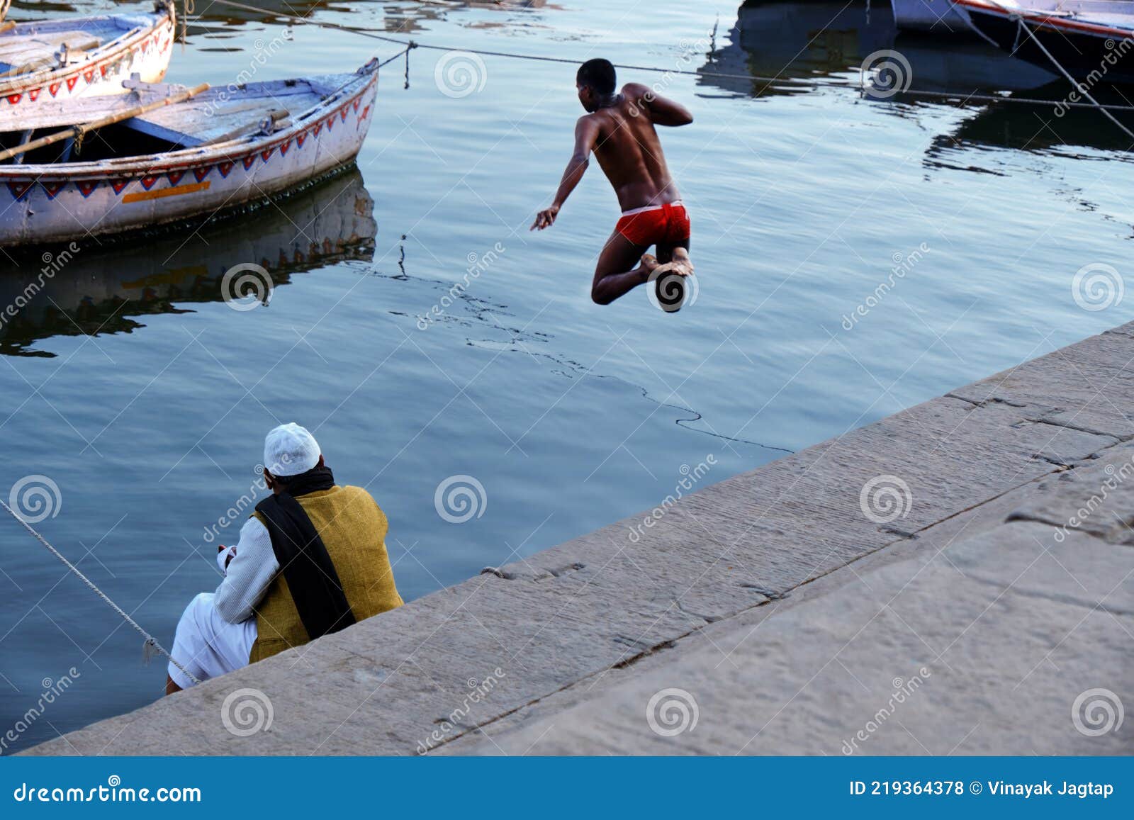 Young Men Jumping & Swimming in Ganga River, Varanasi, Uttar Pradesh ...